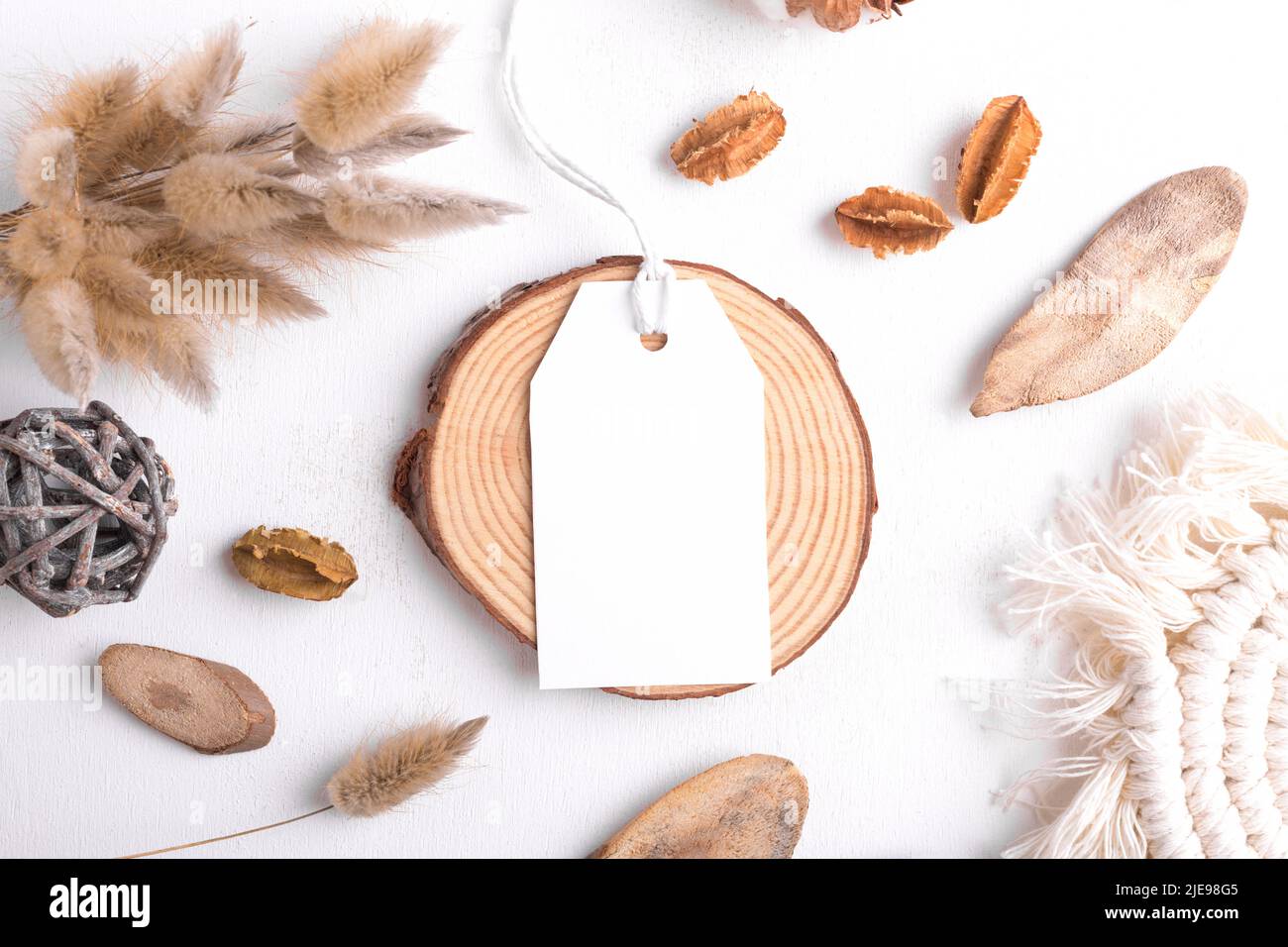 Rectangle white tag mockup on a white background with cotton string and ...