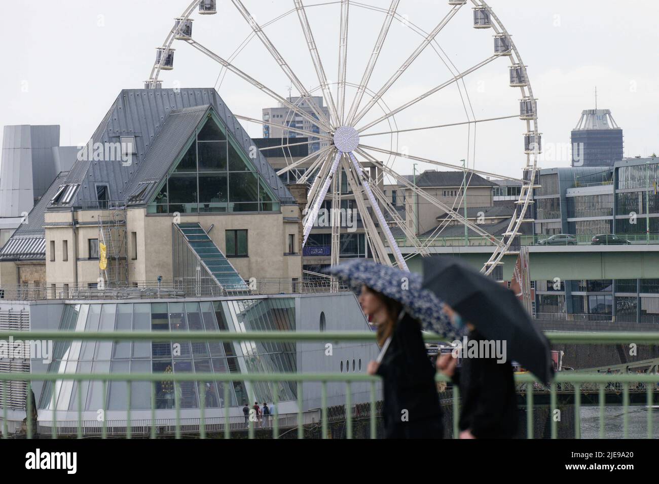 Cologne, Germany. 26th June, 2022. Pedestrians on the Deutz Bridge ... Cologne, Germany. 26th June, 2022. Pedestrians on the Deutz Bridge ...