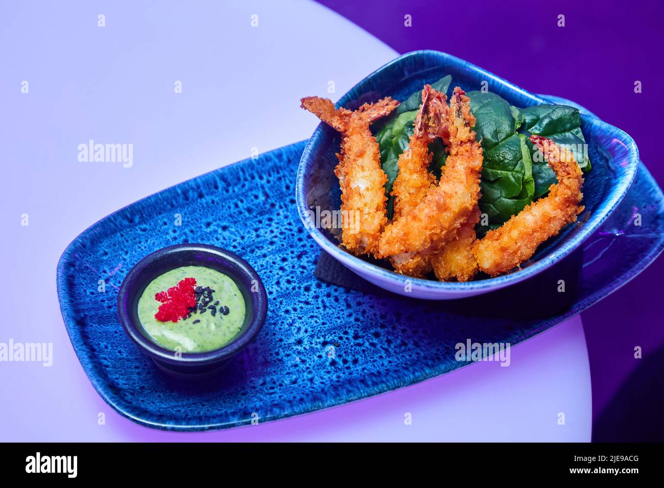King prawns in tempura on a blue plate Stock Photo - Alamy