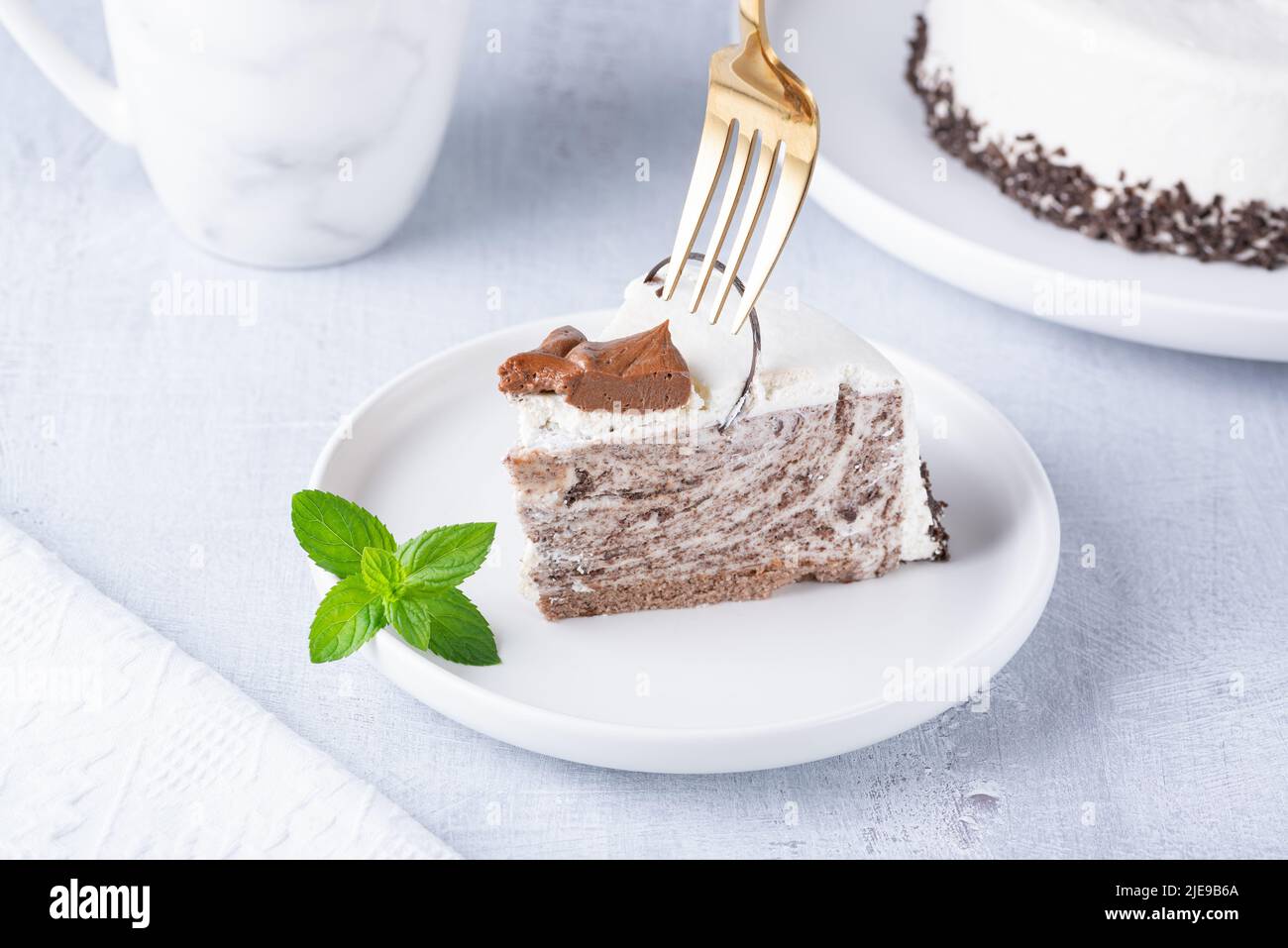 Eating chocolate cheesecake. Taking bite of cheesecake with fork Stock ...