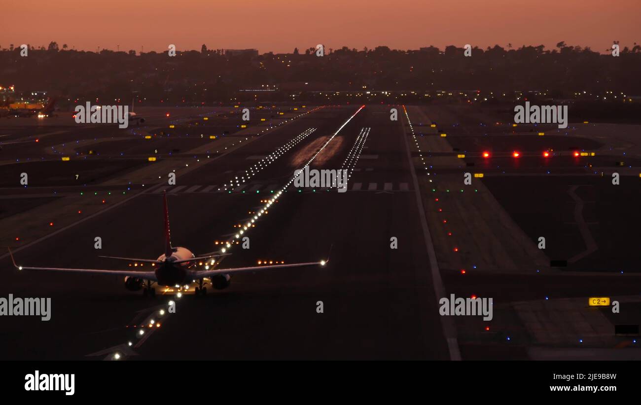 Airport runway lights at night, plane or airplane taking off from ...