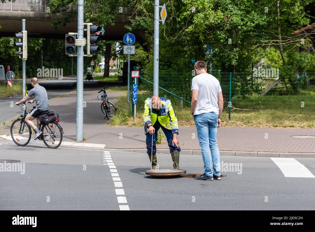 Oldenburg, Germany. 26th June, 2022. Marc Meyerholz opens a manhole ...