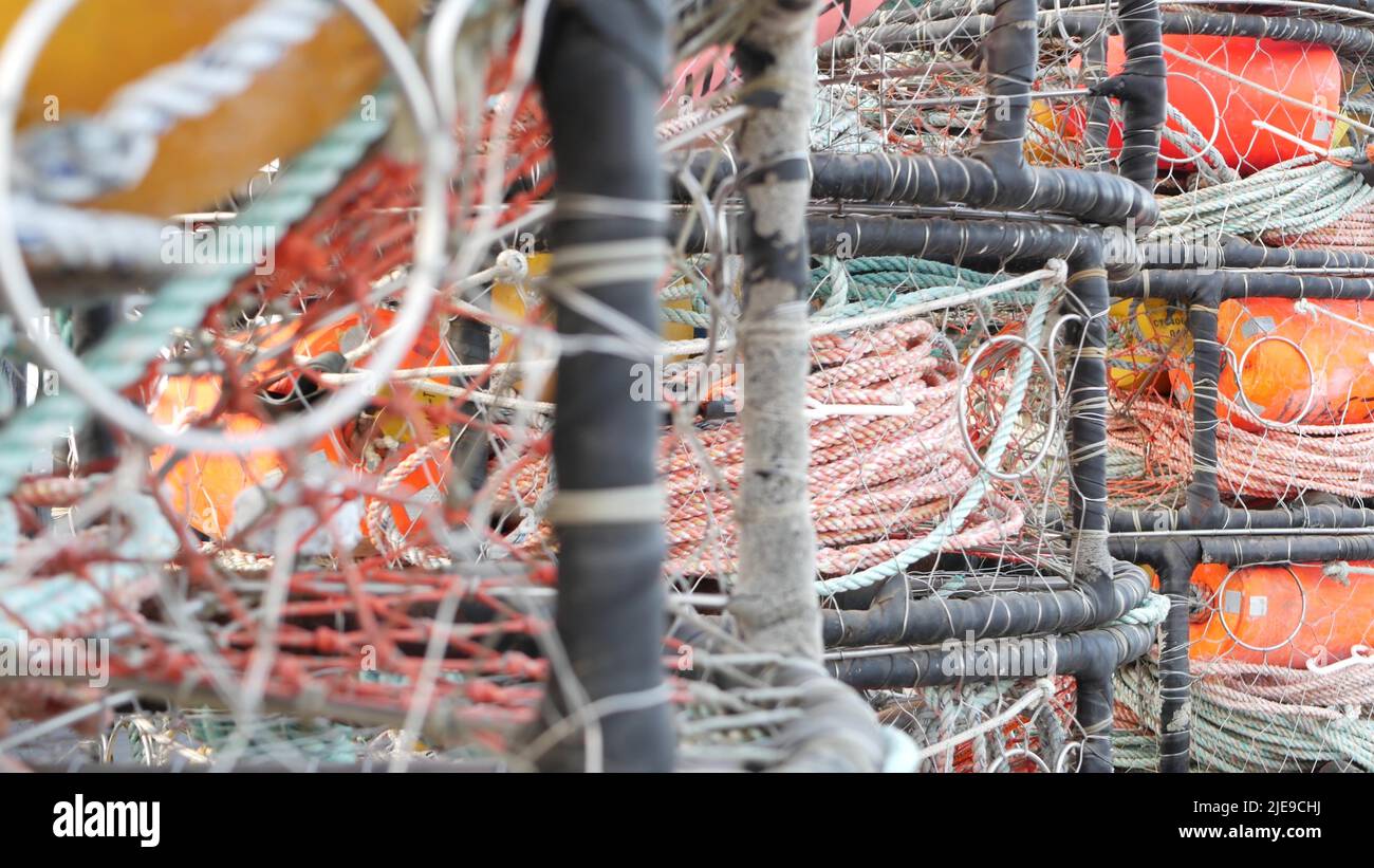 Traps, ropes and cages on pier, commercial dock, fishing industry ...