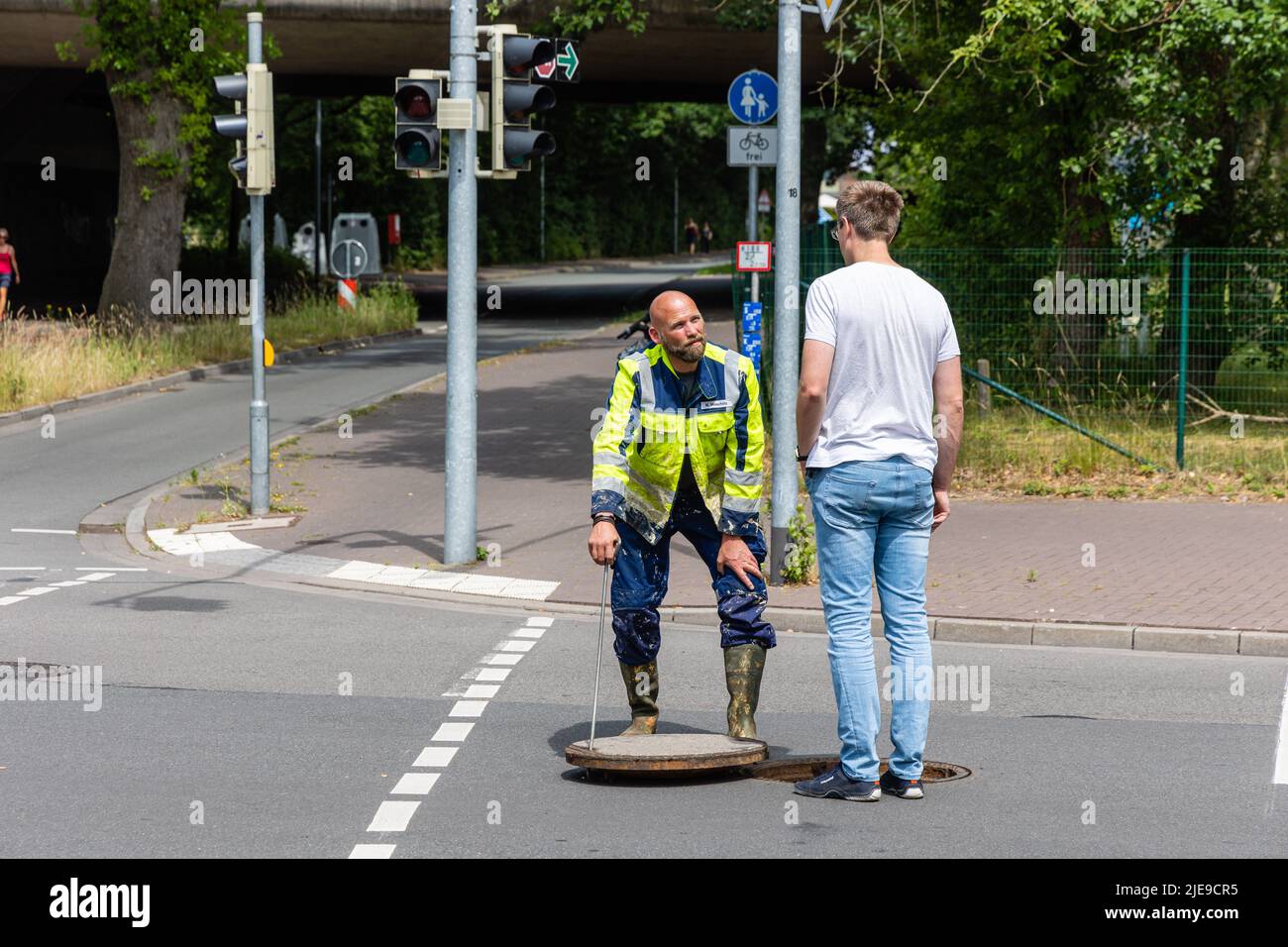 Oldenburg, Germany. 26th June, 2022. Marc Meyerholz opens a manhole ...