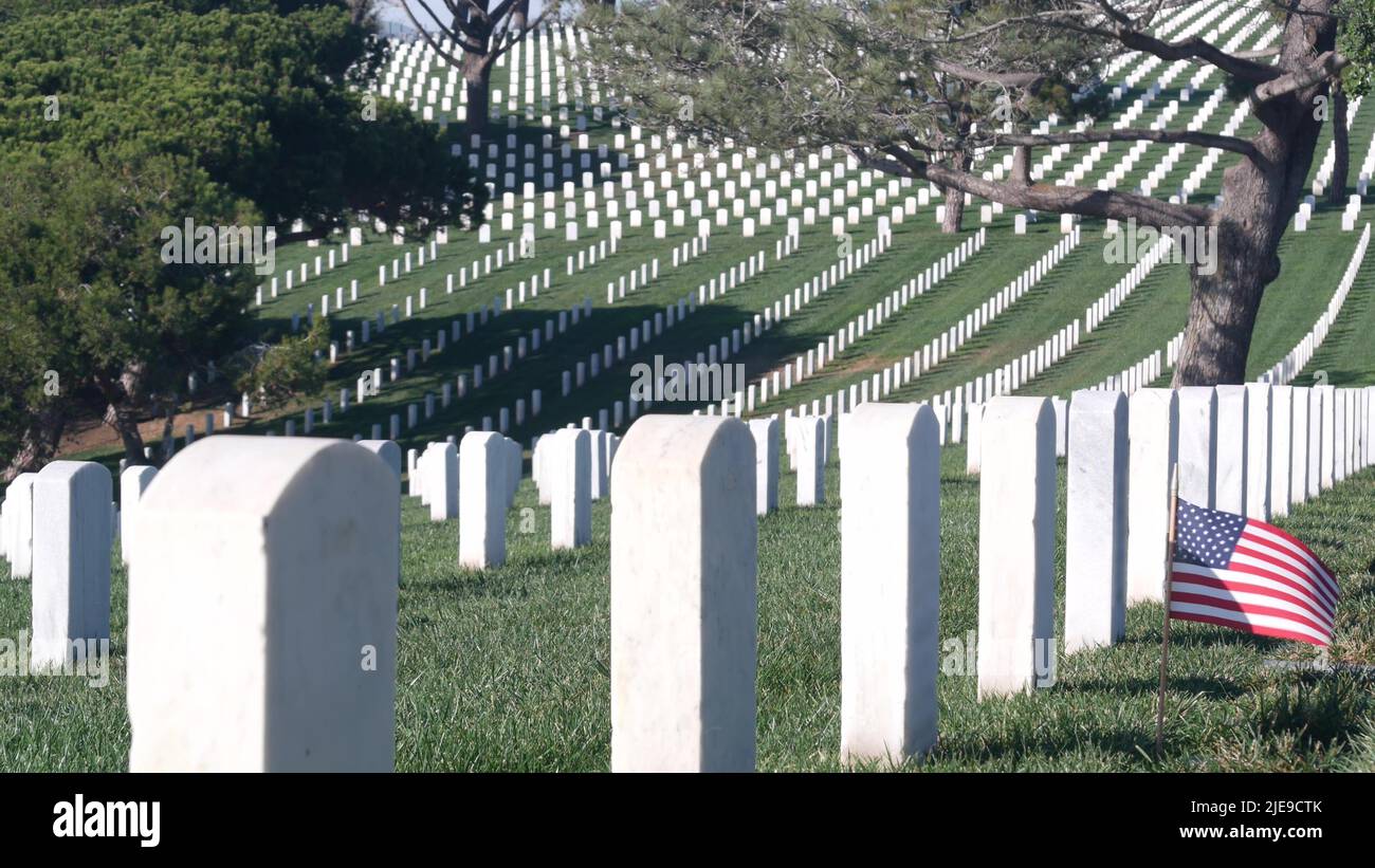 Tombstones and american flag, national memorial cemetery, military ...