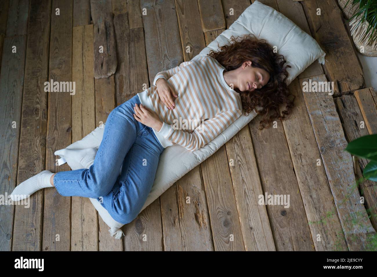Beautiful young calm woman sleeping, napping during day on mattress on ...