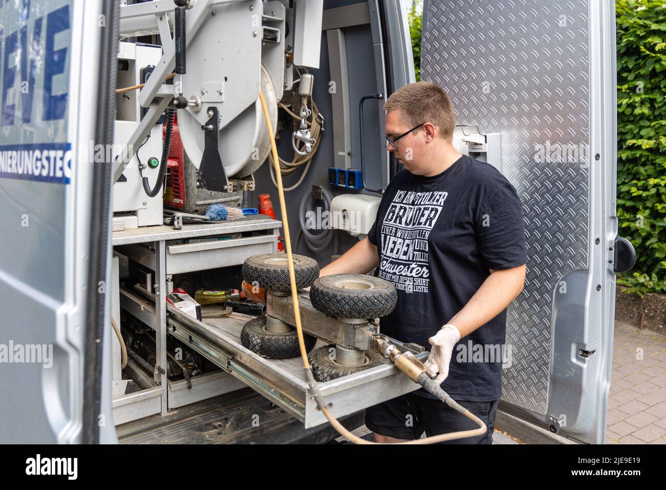 Oldenburg, Germany. 26th June, 2022. Damian Bodde inspects a robot ...