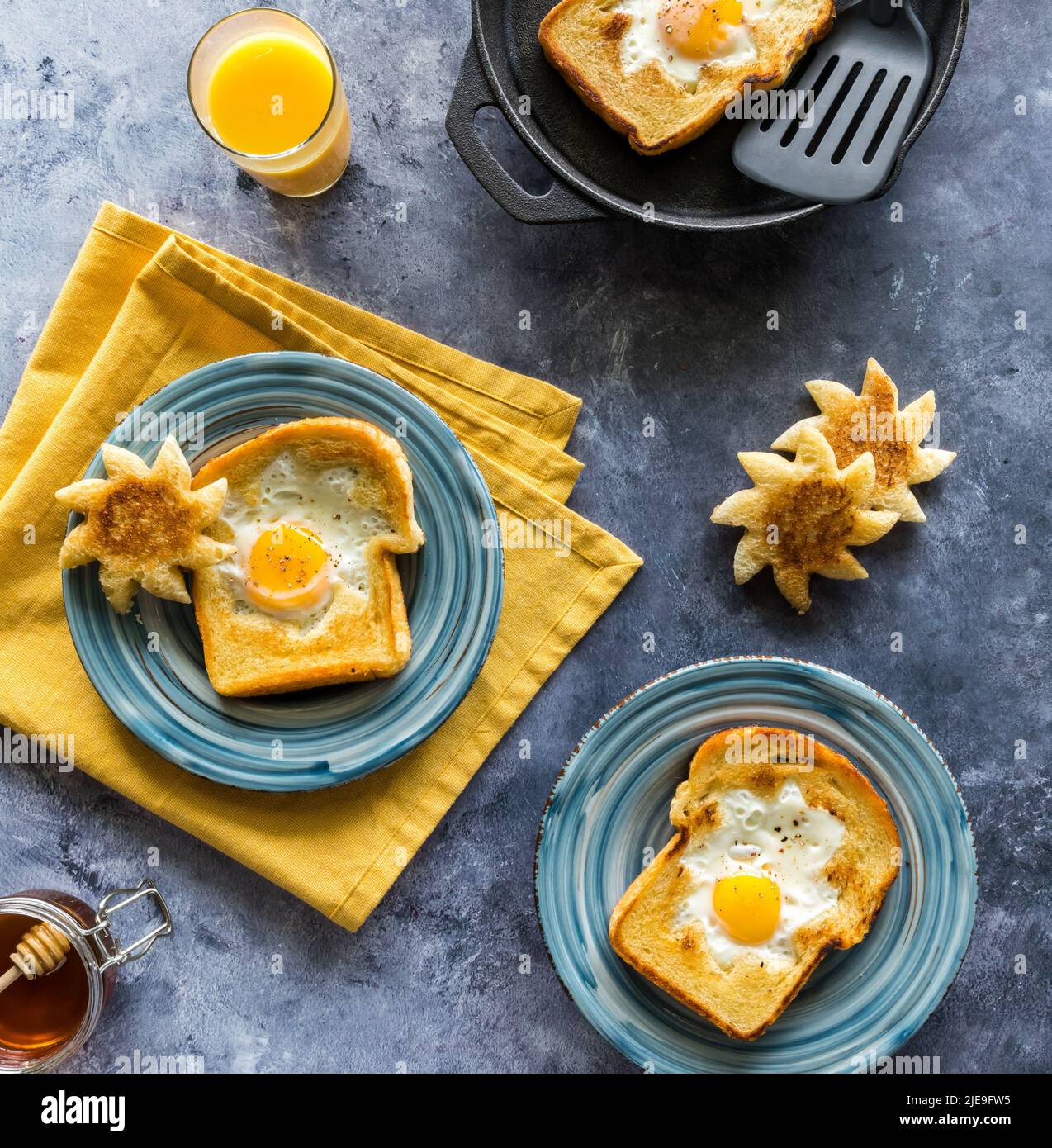 Fried egg sunshine toasts on plates, ready for eating Stock Photo - Alamy
