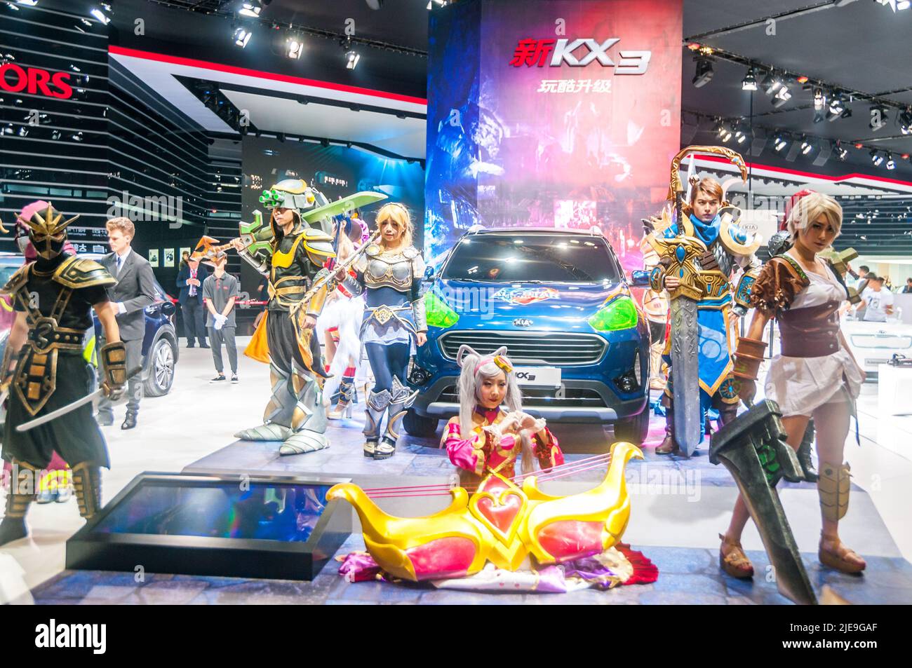 Cosplayers displaying the Kia KX3 crossover at the 2016 Guangzhou Auto ...