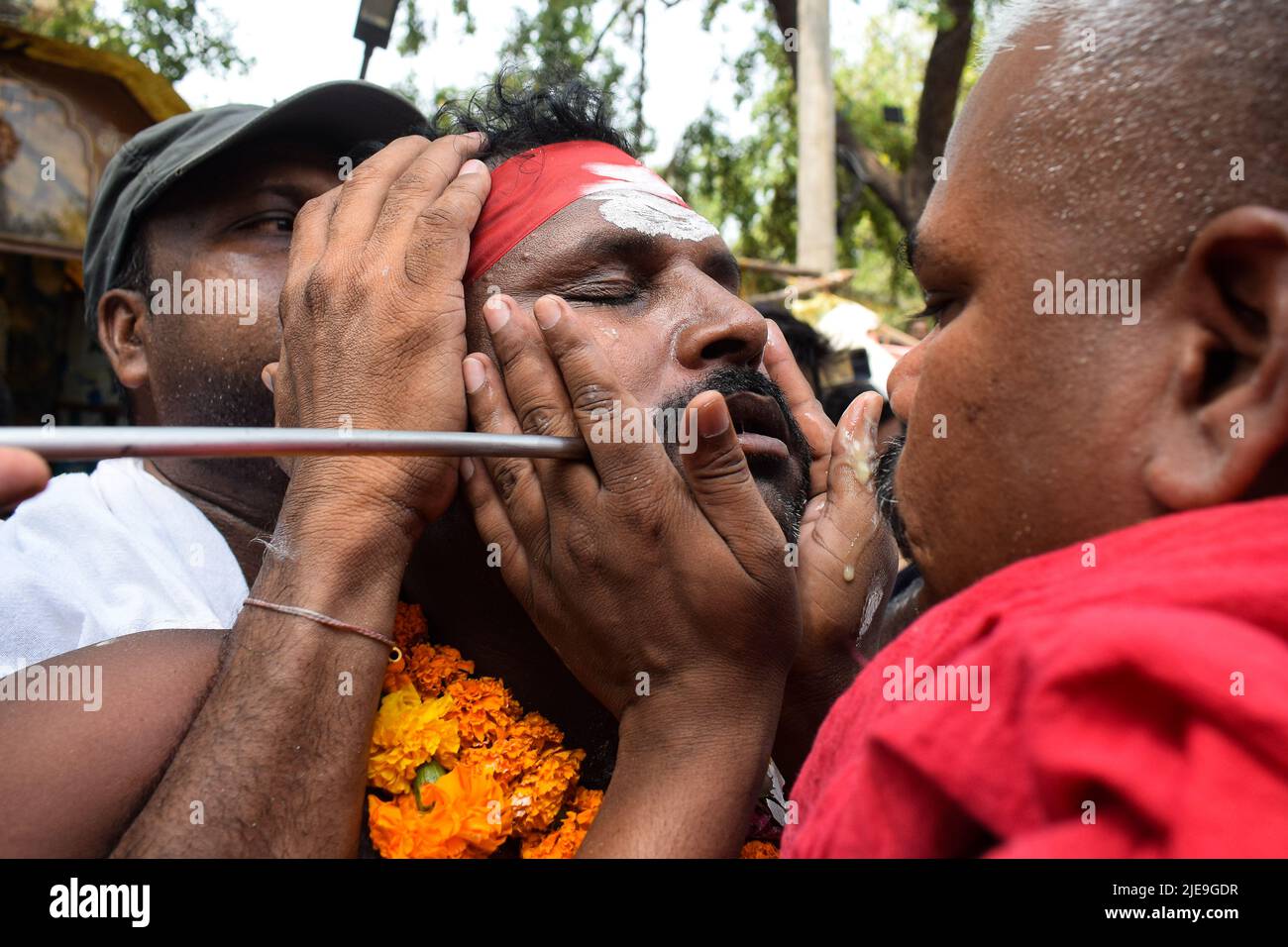 New Delhi, New Delhi, India. 26th June, 2022. A temple priest performs ...