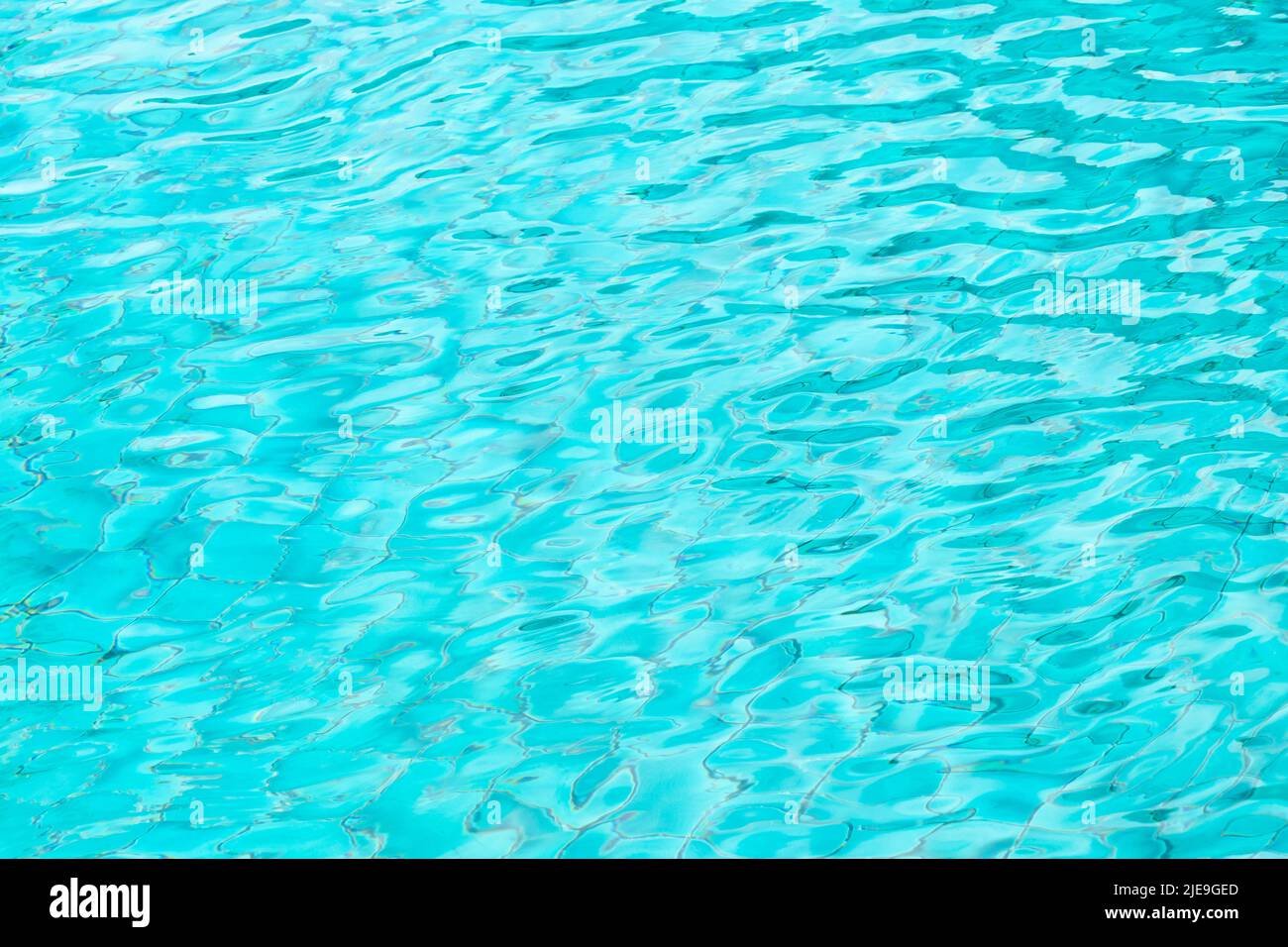 Ripple Water in swimming pool with blue tile floor background Stock ...