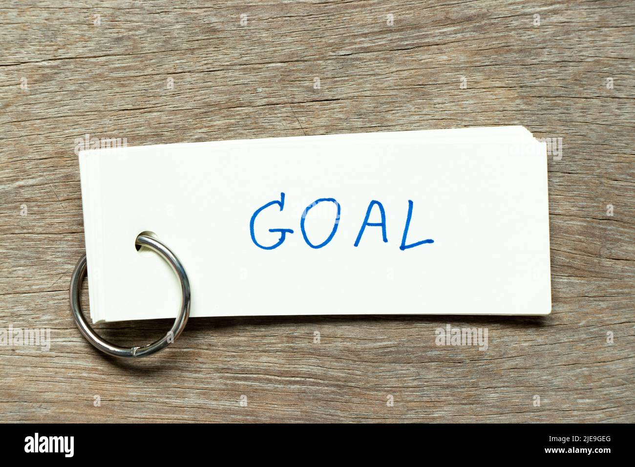 Flash card with handwriting word goal on wood background Stock Photo ...