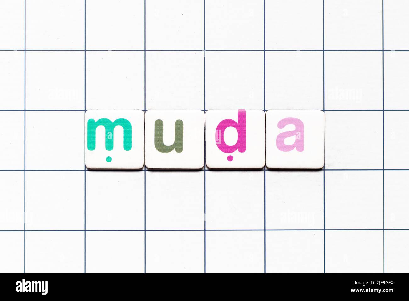 Colorful tile letter in word muda on white grid background Stock Photo ...