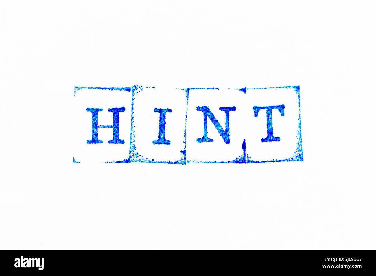 Blue color ink rubber stamp in word hint on white paper background ...