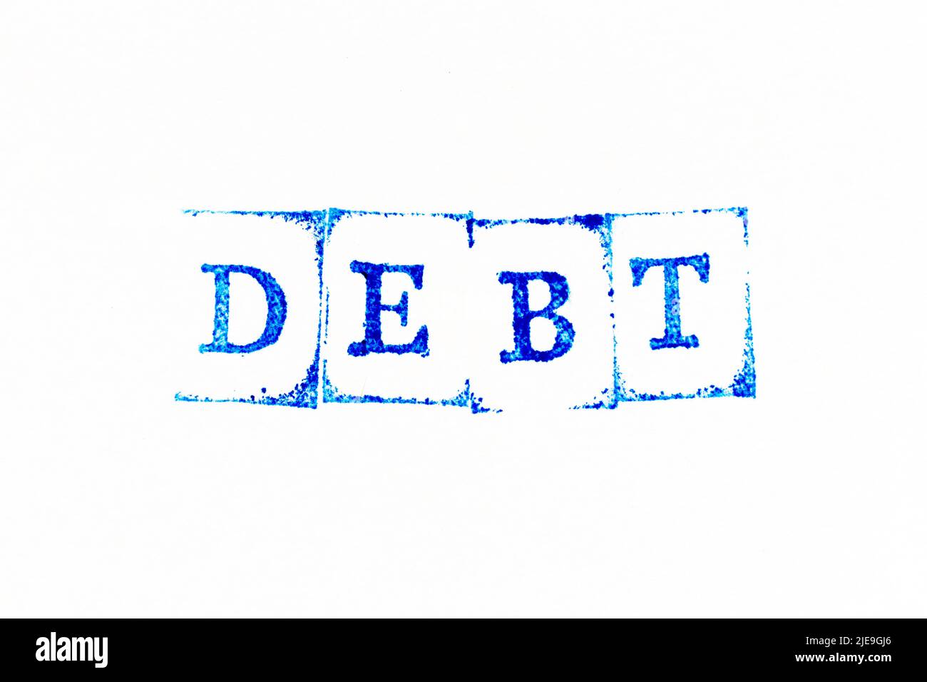 Blue color ink rubber stamp in word debt on white paper background ...
