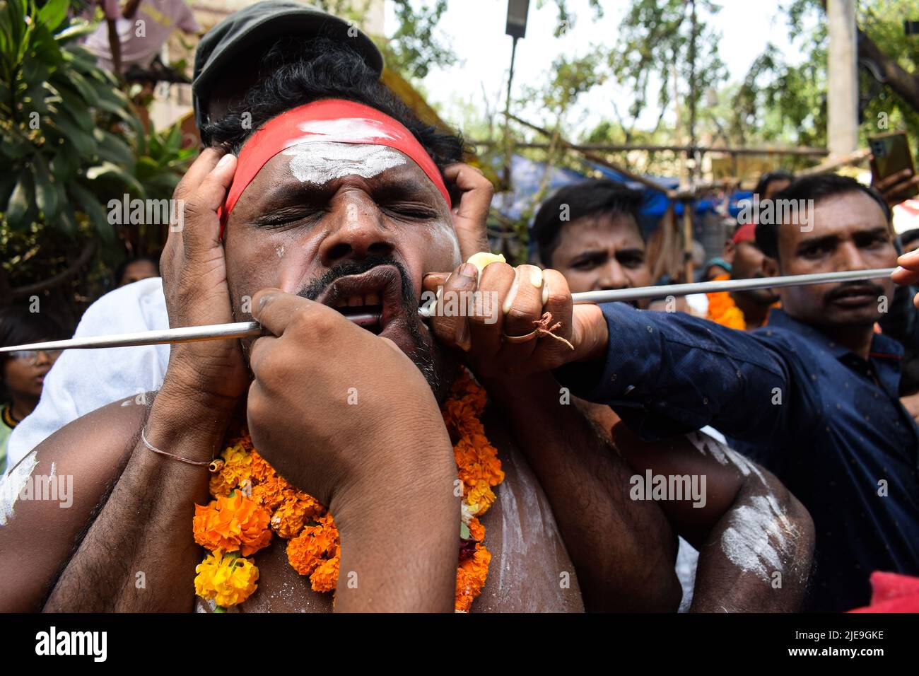 New Delhi, New Delhi, India. 26th June, 2022. A temple priest performs ...