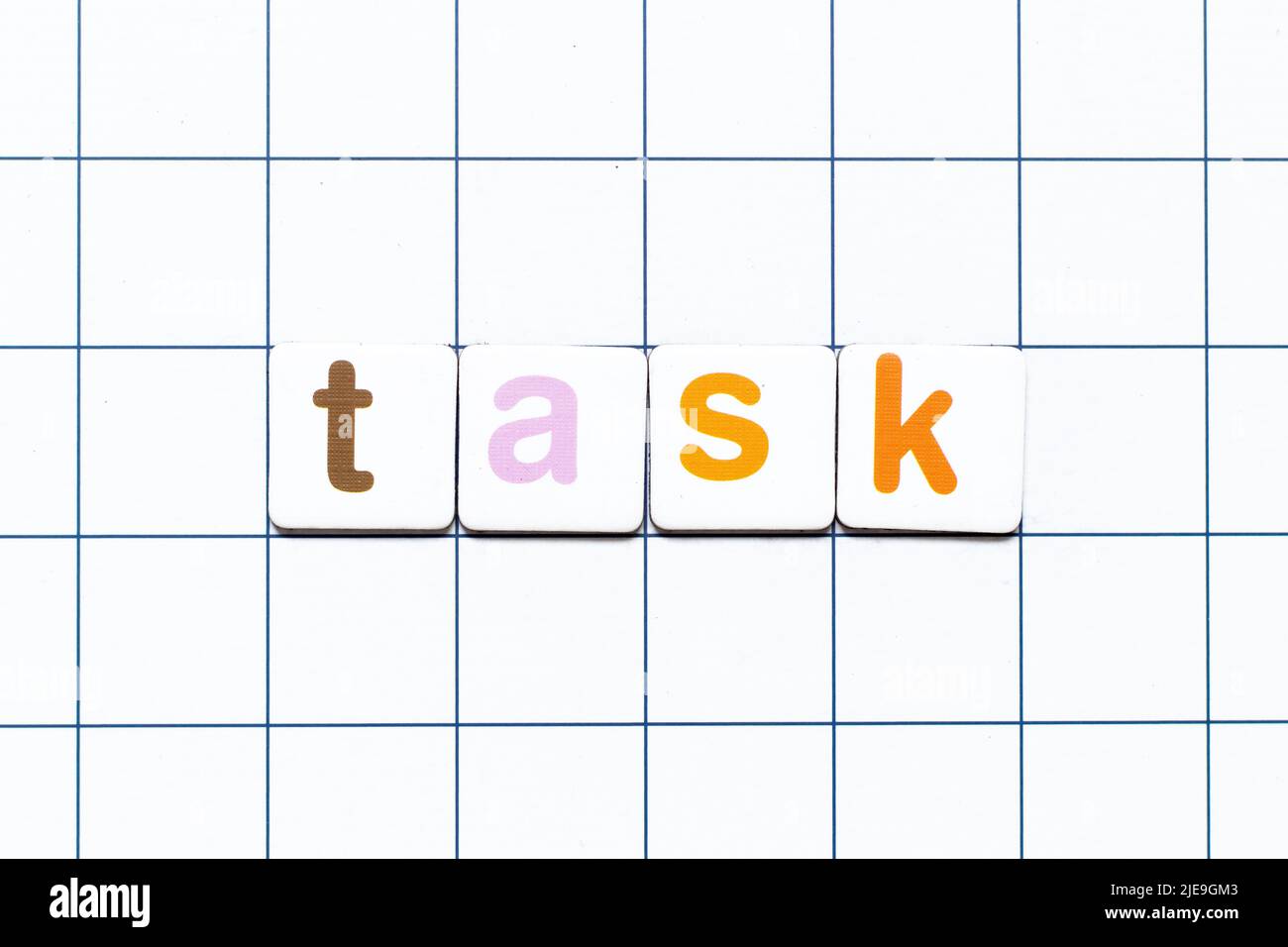 Colorful tile letter in word task on white grid background Stock Photo ...