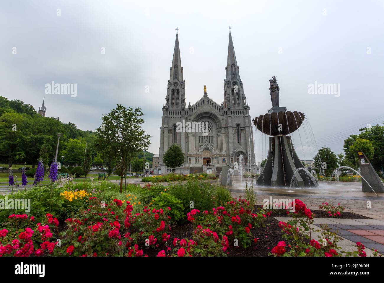 Beautiful fountain in front of the majestic Basilica of Sainte-Anne-de ...