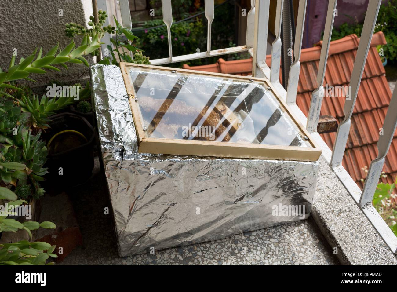 Homemade bee wax solar melter on the terrace melts honeycombs with sun ...