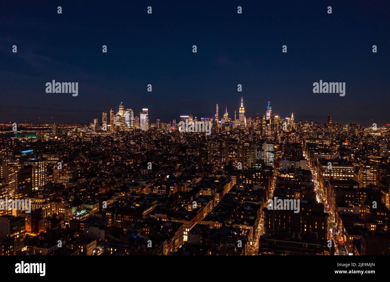 Night cityscape. Lighted windows in town development and illuminated ...