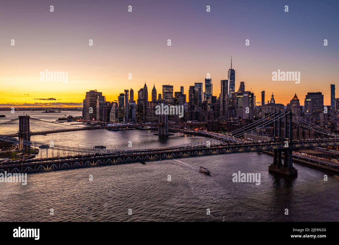 Large cable stayed bridges spanning East River. Skyline with downtown ...
