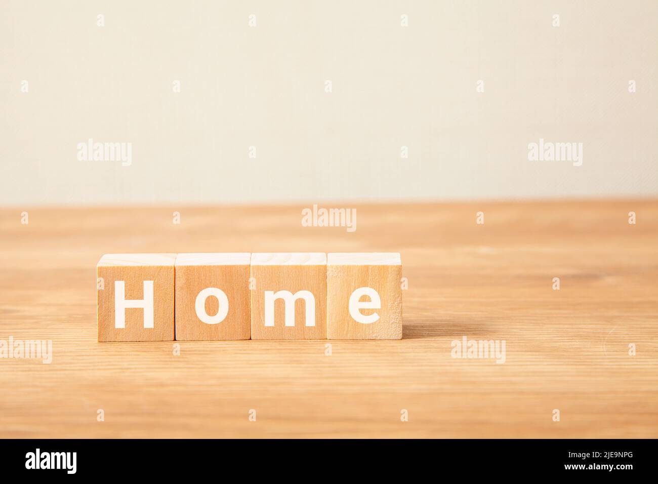 Home character. home. Written on four wooden blocks. White letters ... Home character. home. Written on four wooden blocks. White letters ...