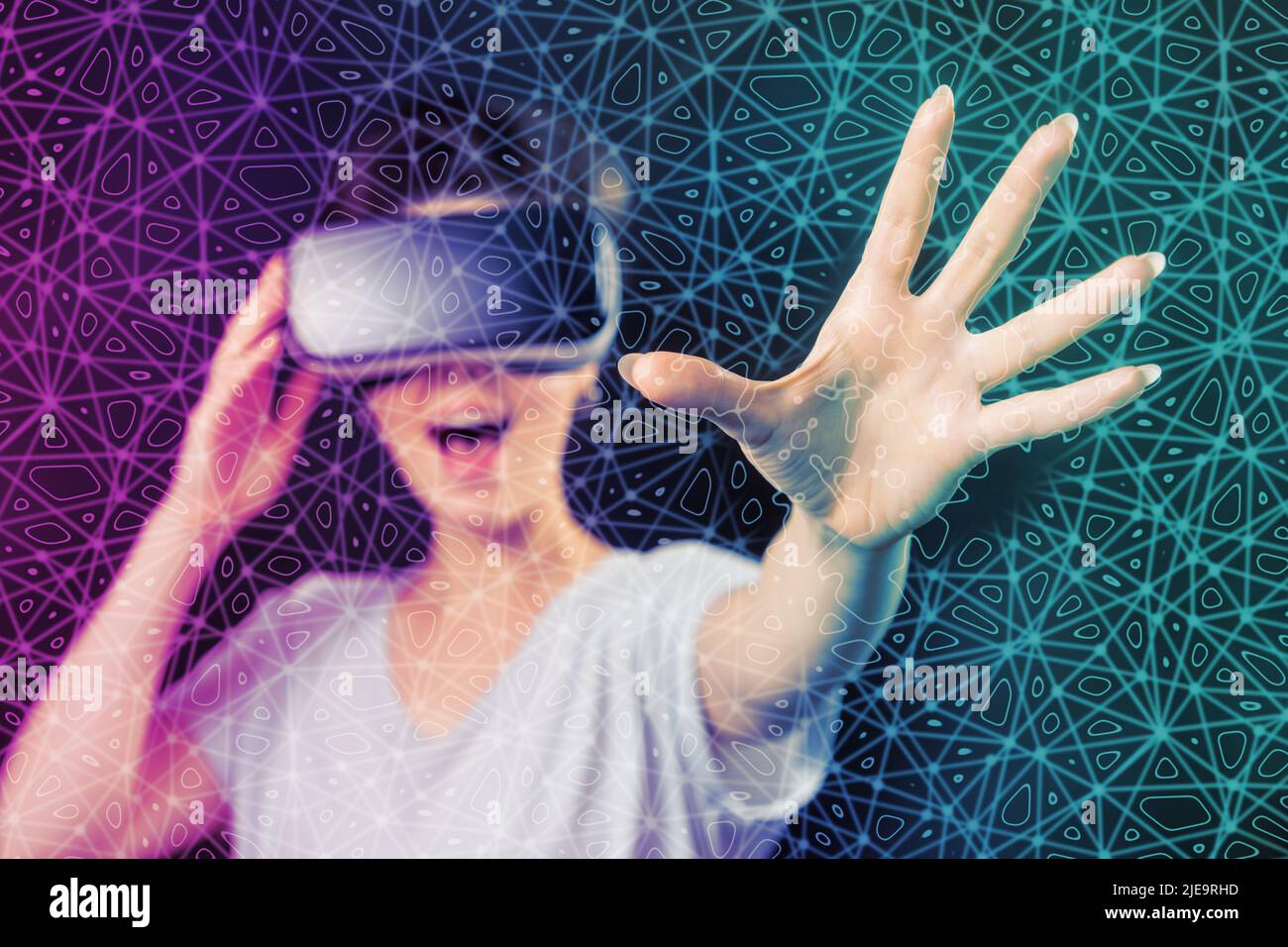 Metaverse. Blurry portrait of young happy woman in VR glasses with ...