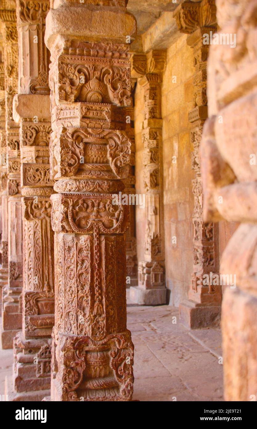 Close-up of ancient columns with great relief work, traditional ...