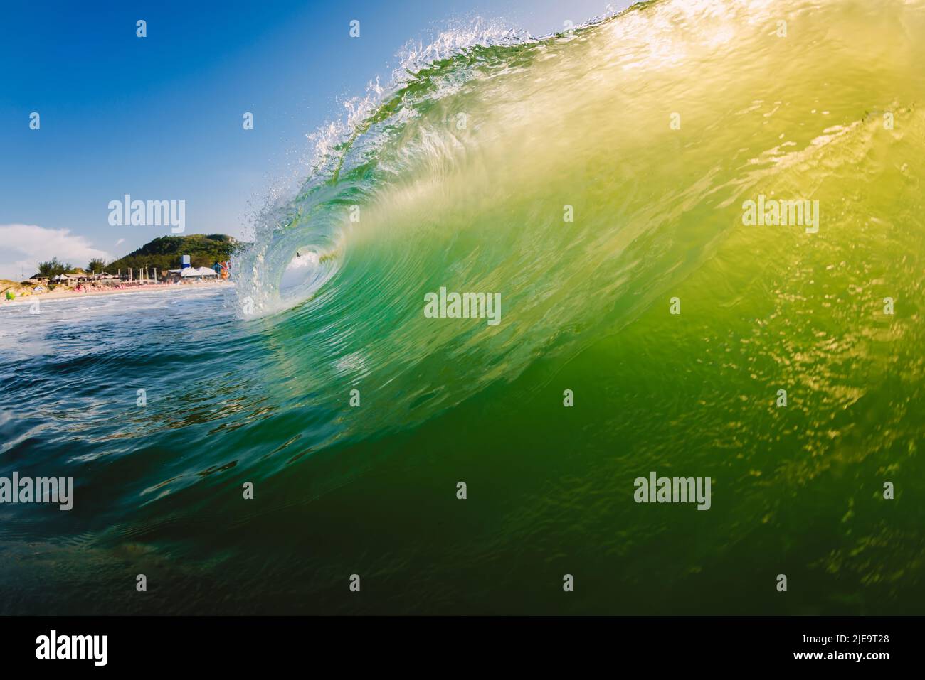 Perfect swell wave breaking in ocean with warm sunlight Stock Photo - Alamy