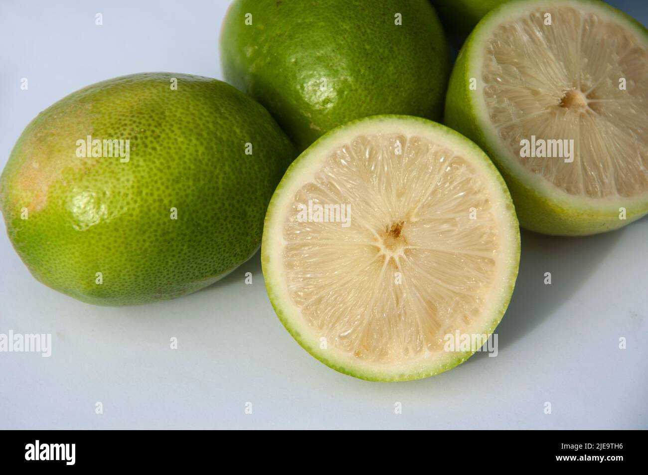 Green seedless lemons isolated on white background. Full depth of field ...