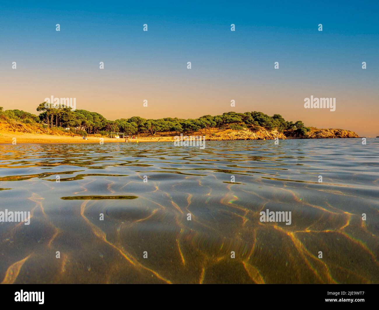 walking out to sea and looking back at the beach and landscape at ...
