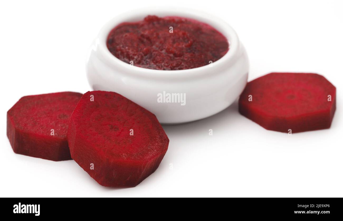 Beetroot and paste in a bowl over white background Stock Photo - Alamy