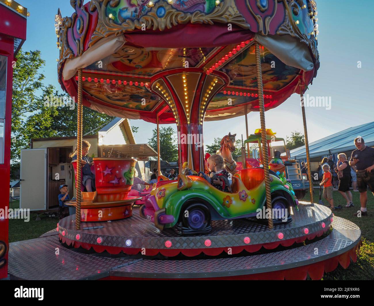 Garham, Germany. 25th June, 2022. Kids seen riding on a carousel, a ...