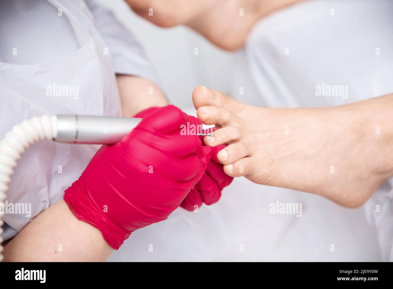 Peeling feet with special electric device. Professional hardware ...