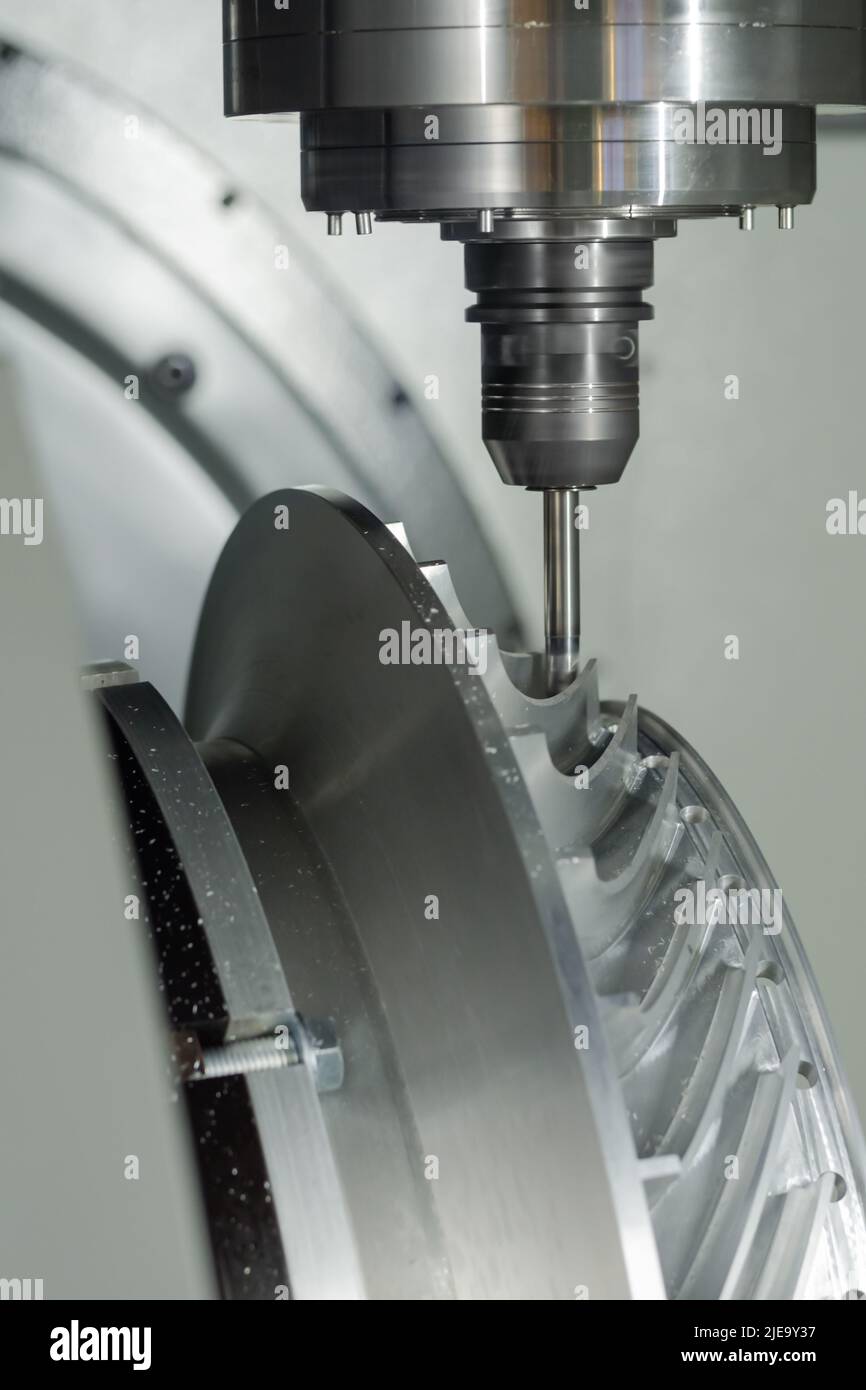 Automated cnc turning milling machine cutting metal workpiece at ...