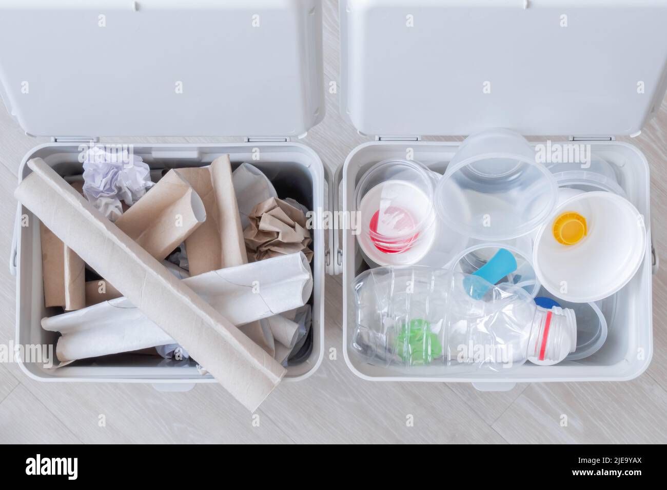 Sorting of garbage in two recycling bins - top view Stock Photo - Alamy