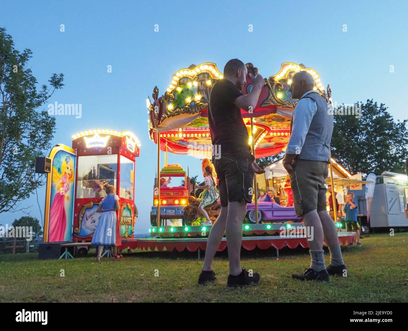 Garham, Germany. 25th June, 2022. Kids seen riding on a carousel, a ...