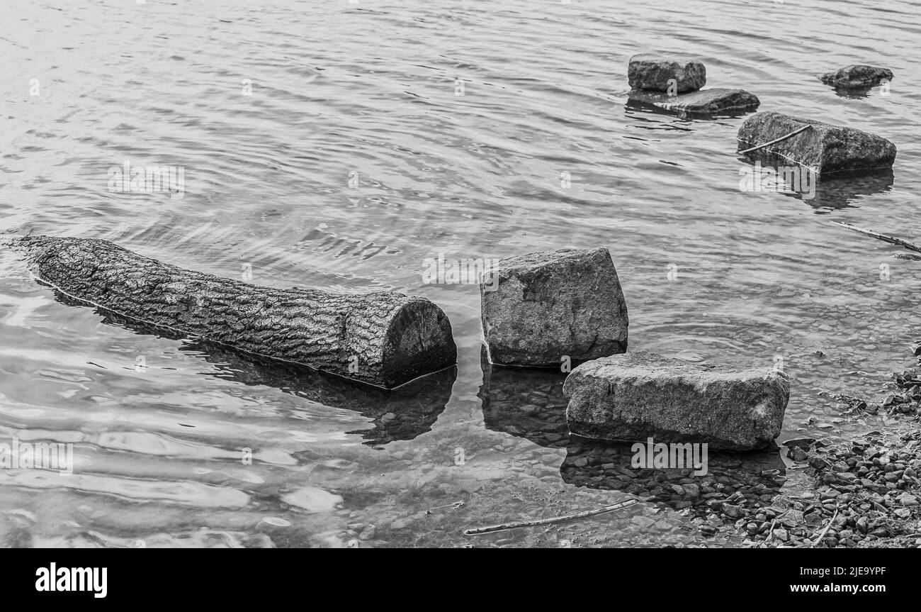 log and rocks Stock Photo - Alamy