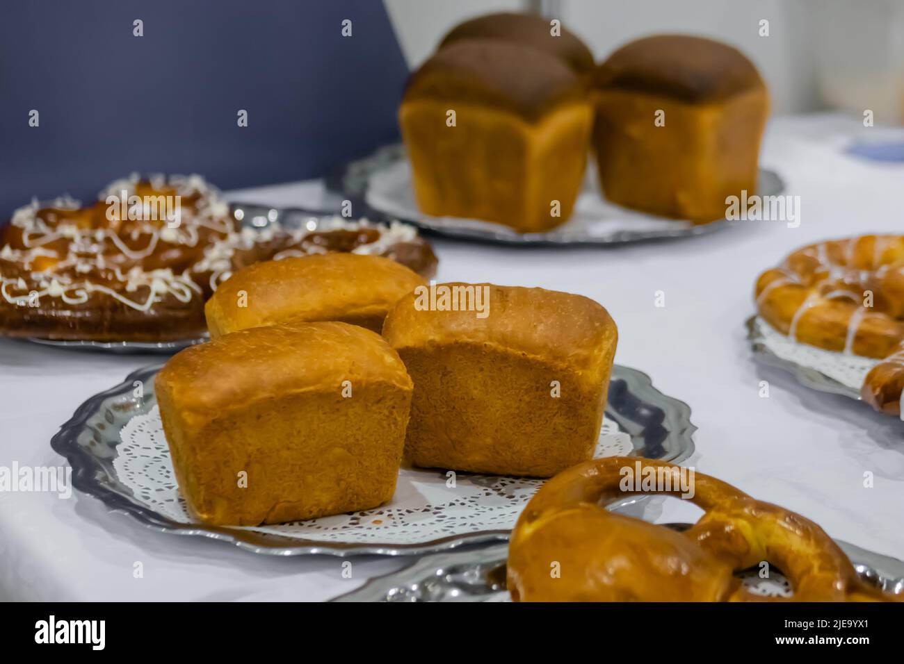 Freshly baked breads on plate at cuisine of cafe, restaurant or bakery ...
