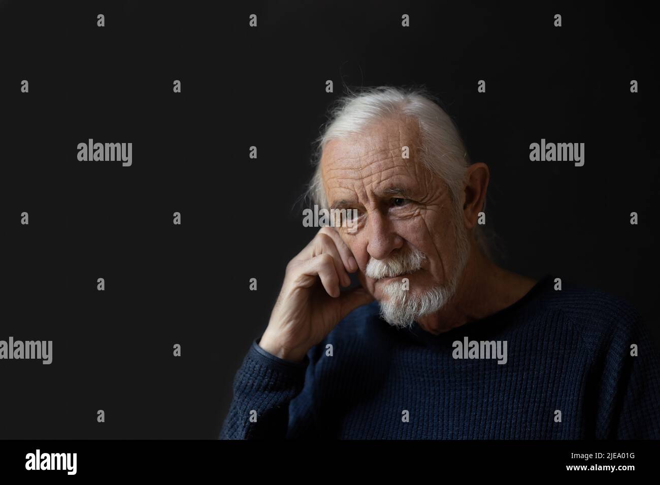Low key studio portrait of sad beautiful gray hair old man Stock Photo ...
