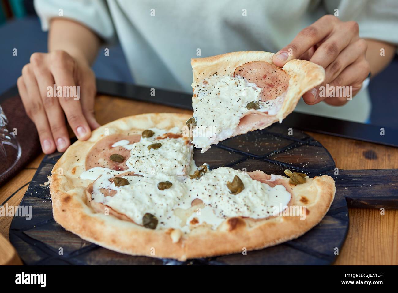 Very cheesy pizza of six kinds of cheese and pistachios. Italian food ...