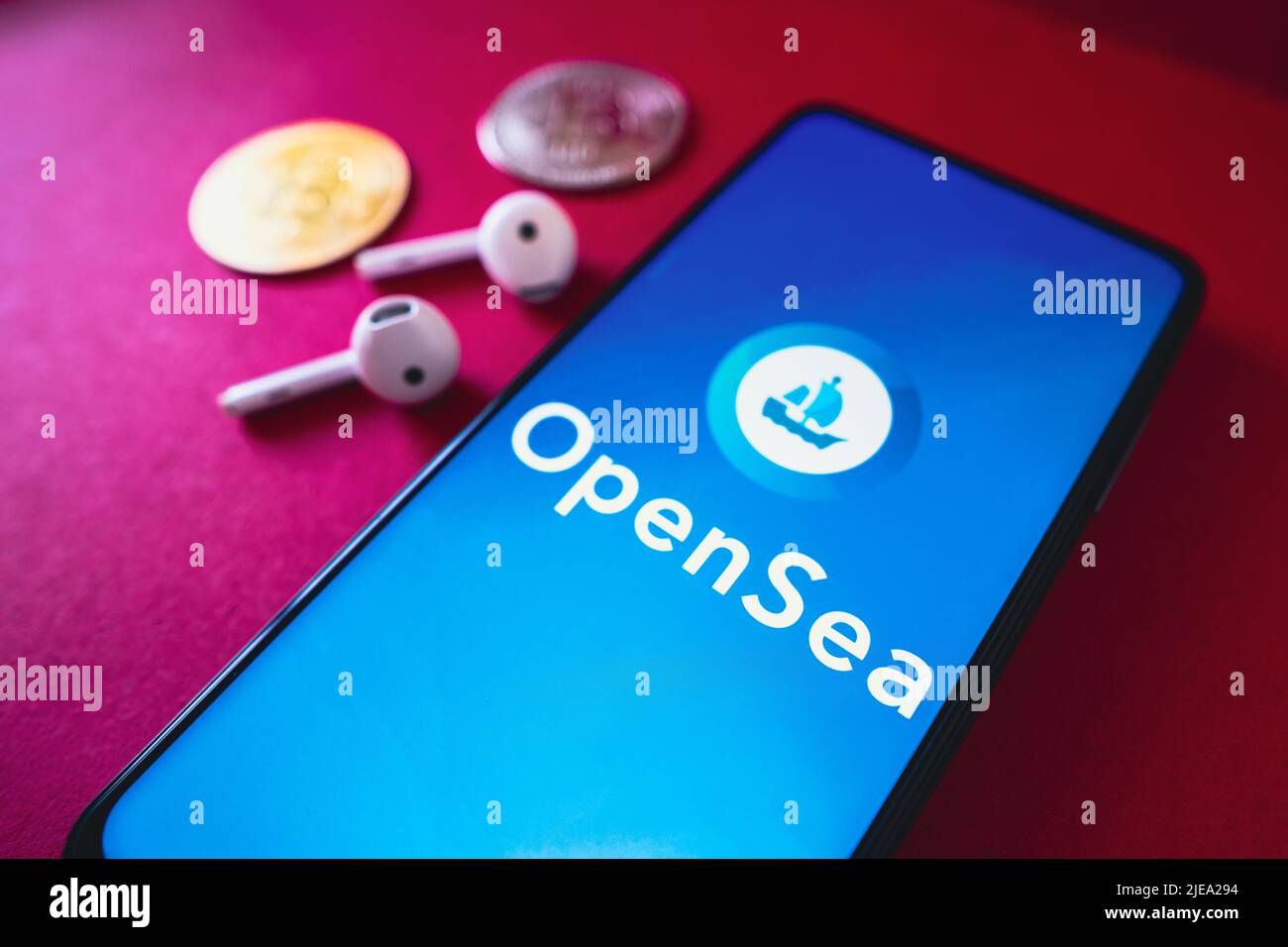 In this photo illustration, the OpenSea logo seen displayed on a ...