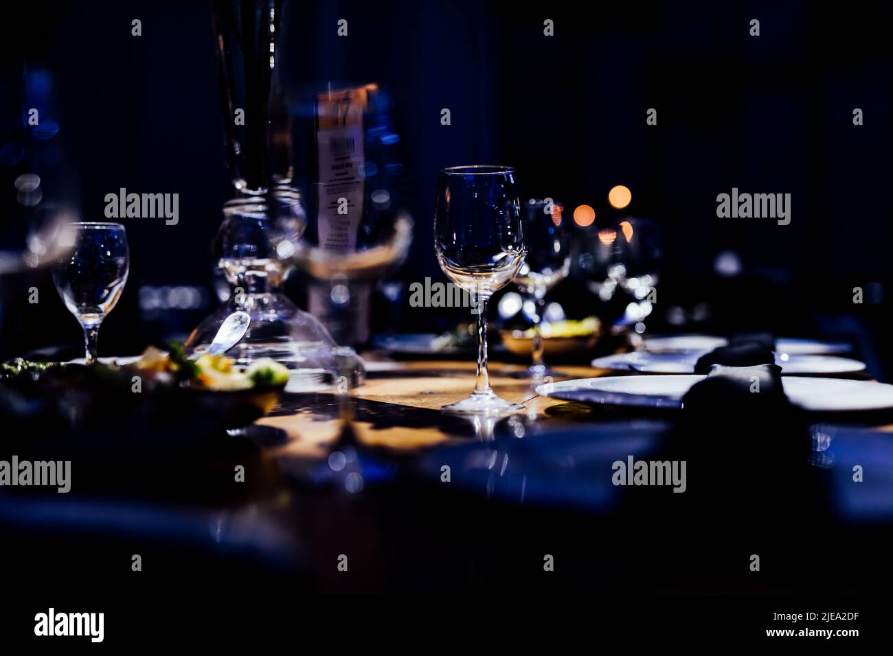 Luxury table settings for fine dining with and glassware, pouring wine ...