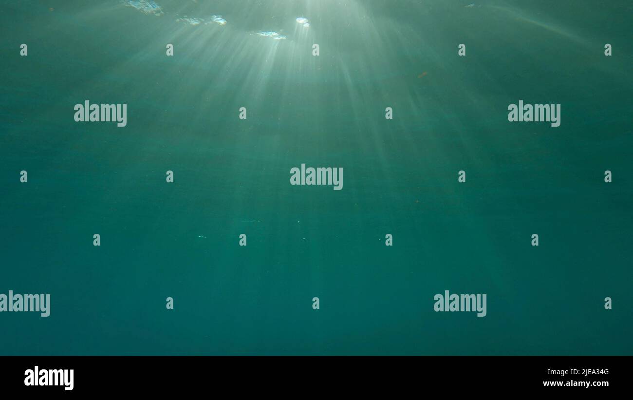 Red Sea, Egypt. 26th June, 2022. Sunrays penetrate through the surface ...