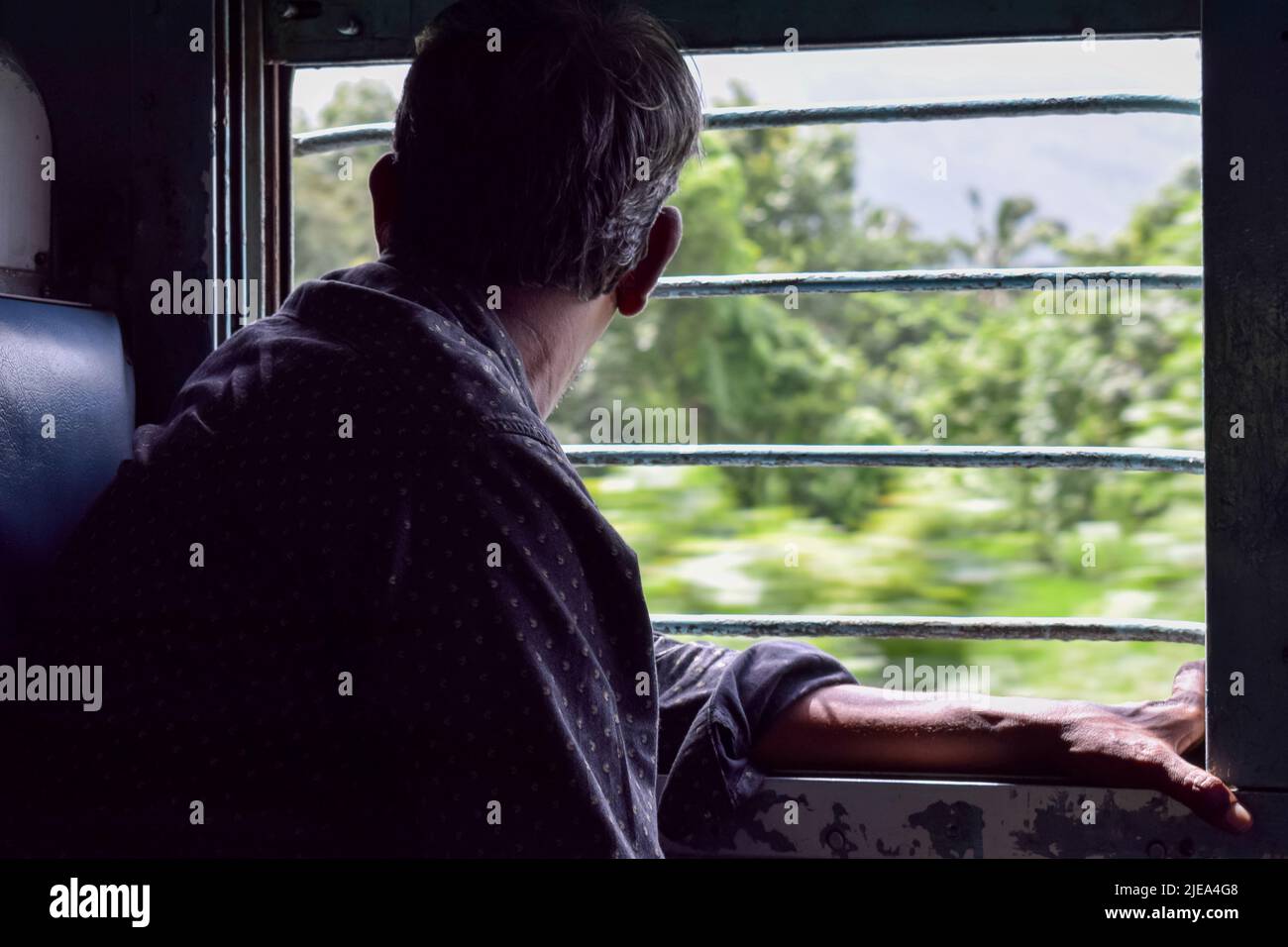 A man looking outside through a train window. Concept - traveling Stock ...