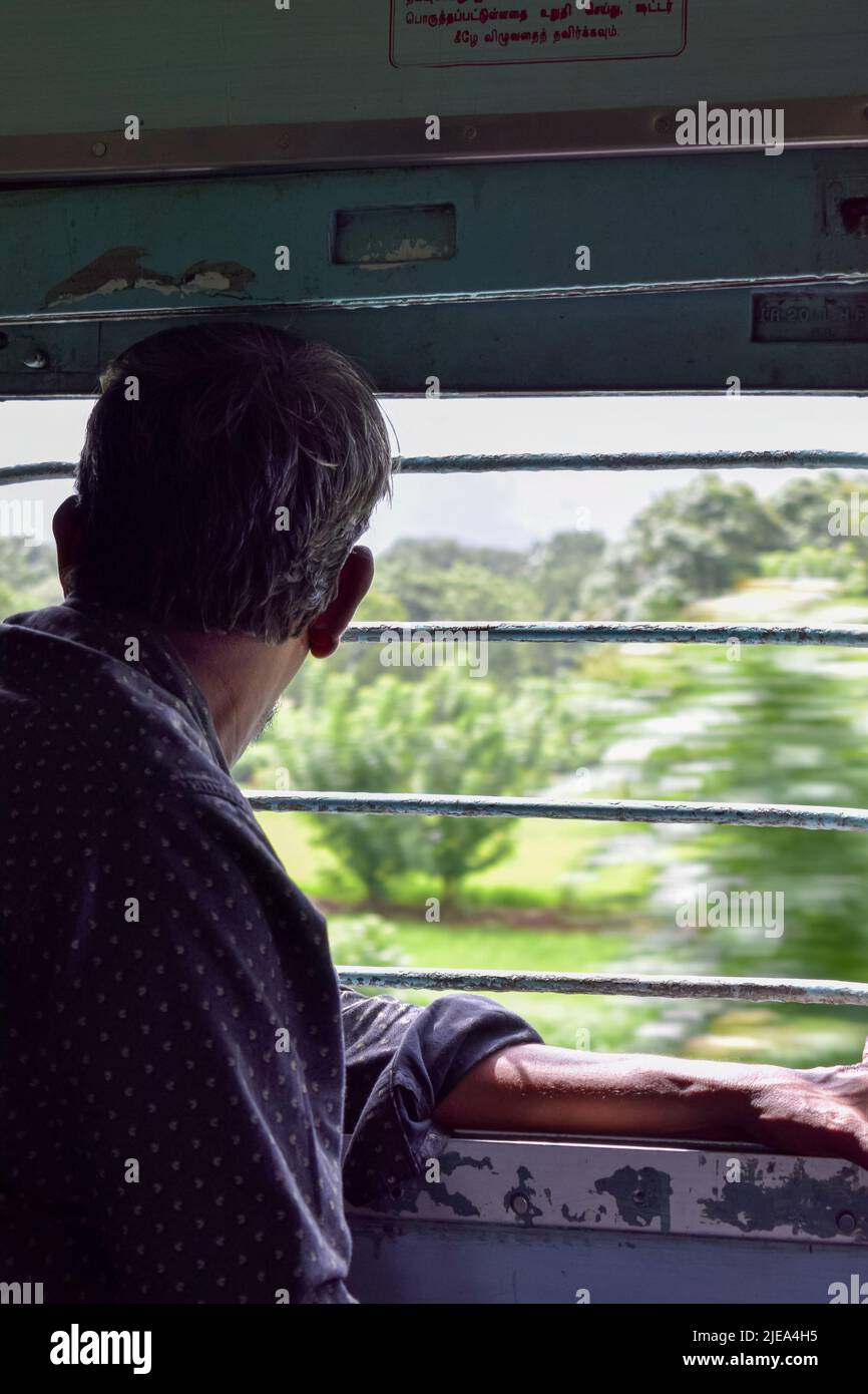 A man looking outside through a train window. Concept - traveling Stock ...