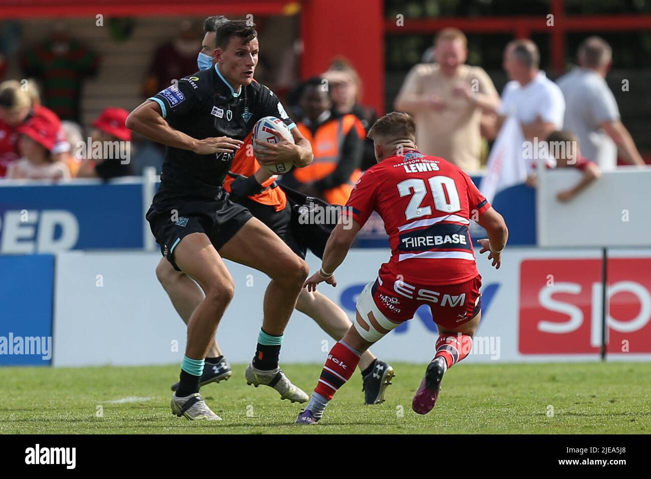 Innes Senior #25 of Huddersfield Giants looks to go past Mikey Lewis ...