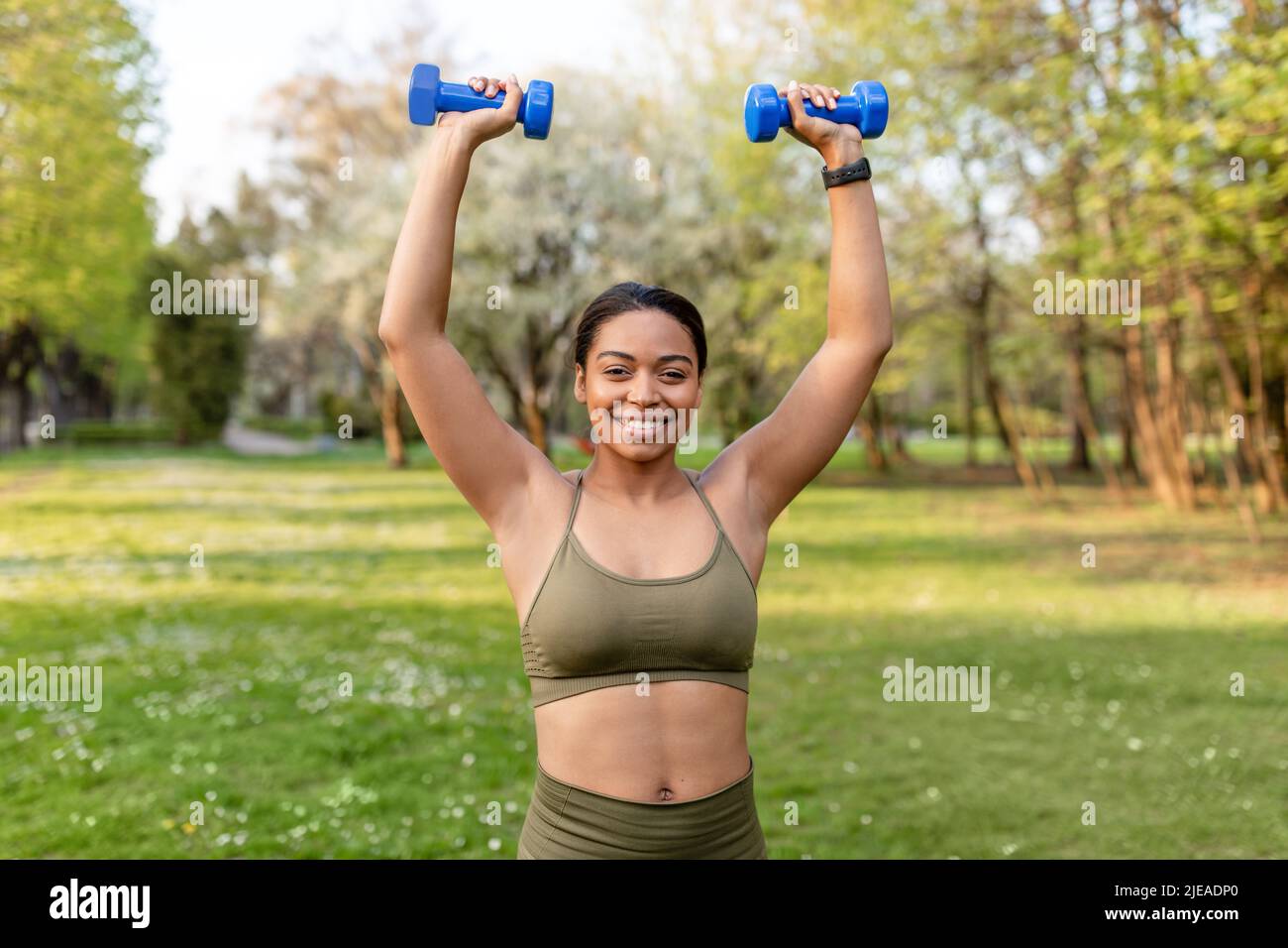 Strong sportive lady training arm hi-res stock photography and images ...