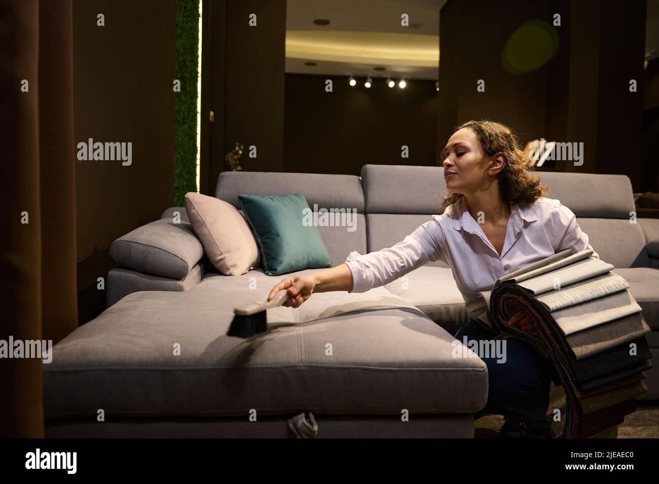 Hispanic creative interior designer, professional decorator holds ...