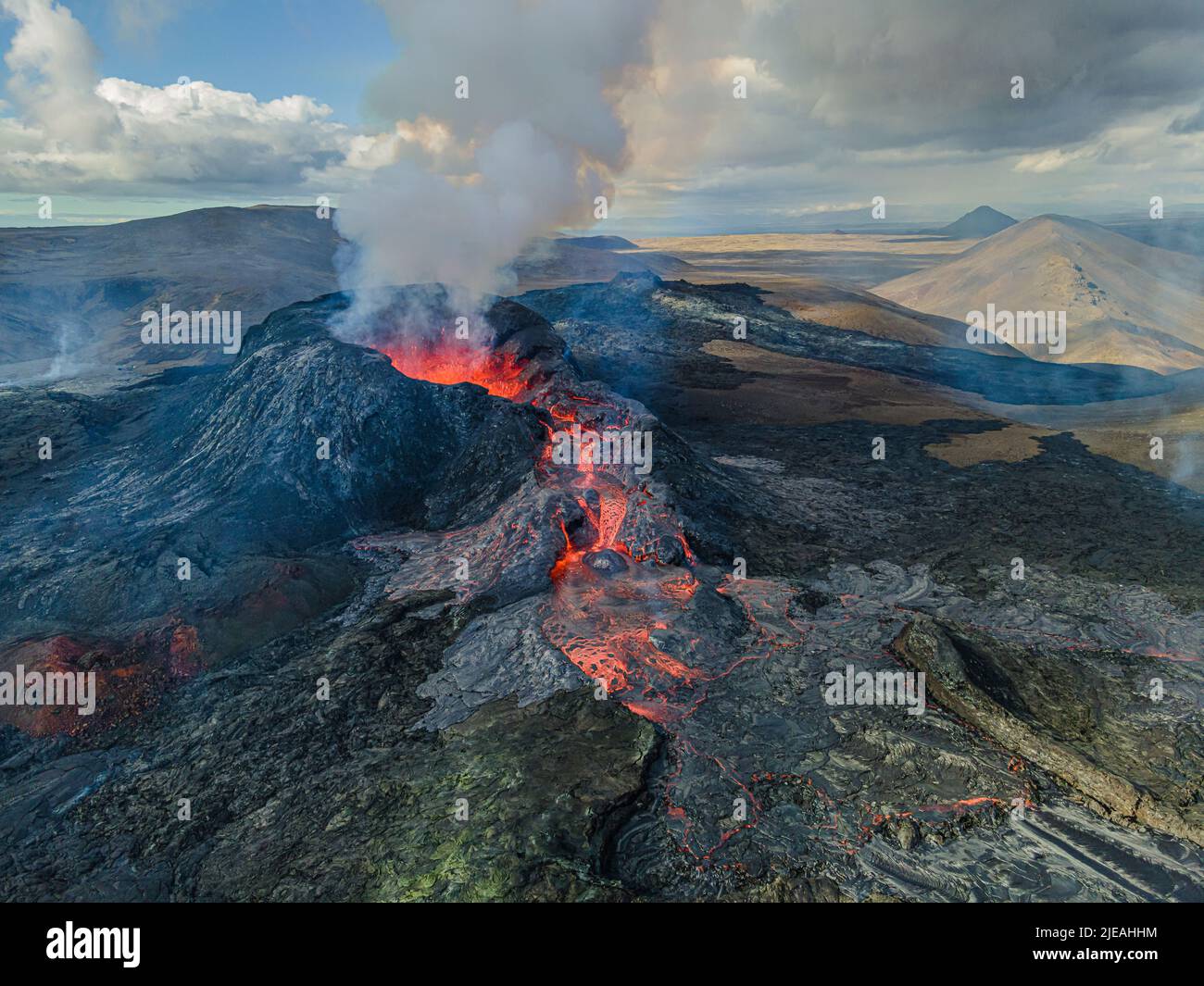 Magma flow of lava flows from the volcanic crater. View into the ...